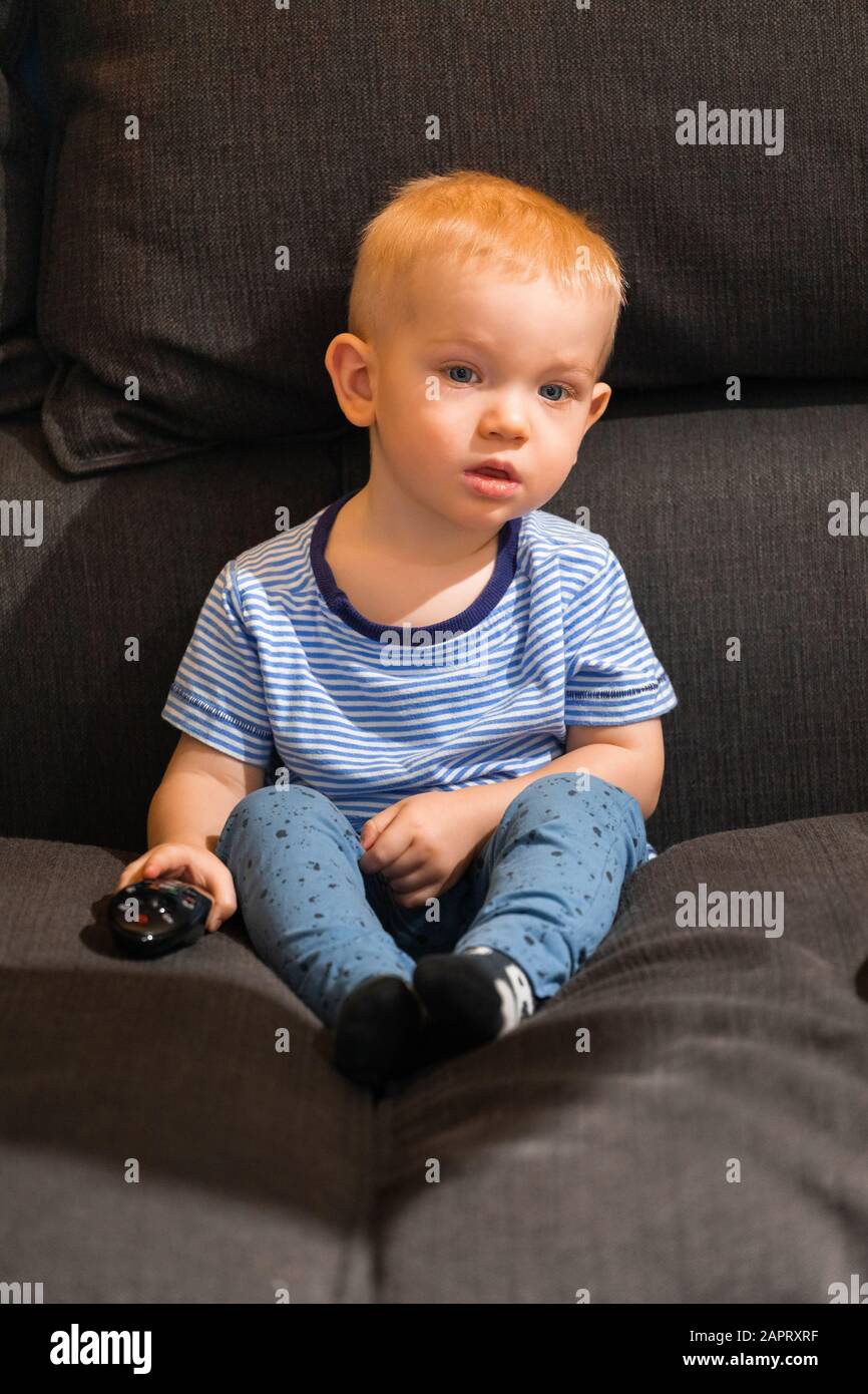 Little boy watching tv Stock Photo - Alamy