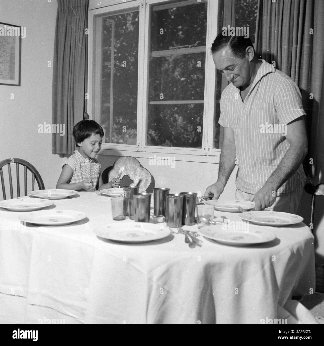 Man dining table Black and White Stock Photos & Images - Alamy