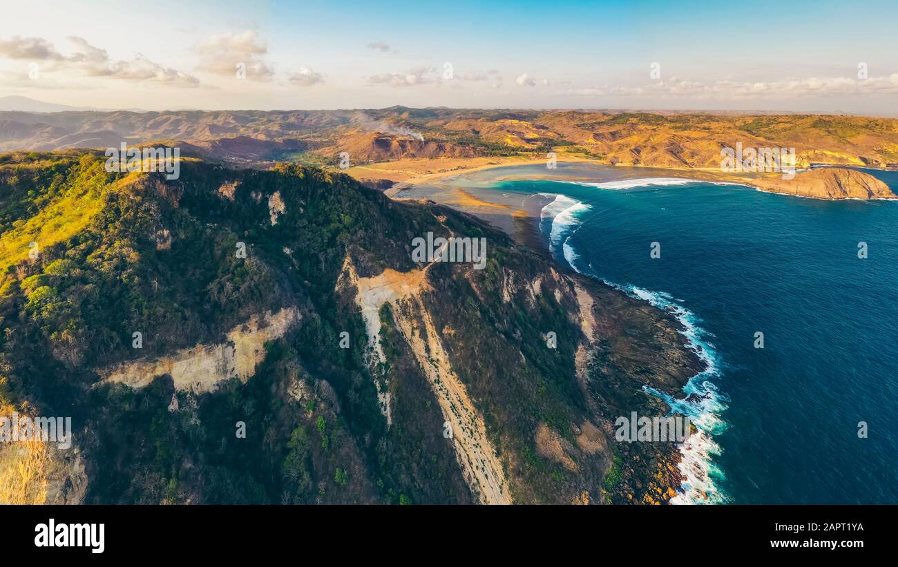 Drone view of Pengempos, Areguling Beach at sunset; Lombok Tengah, West ...