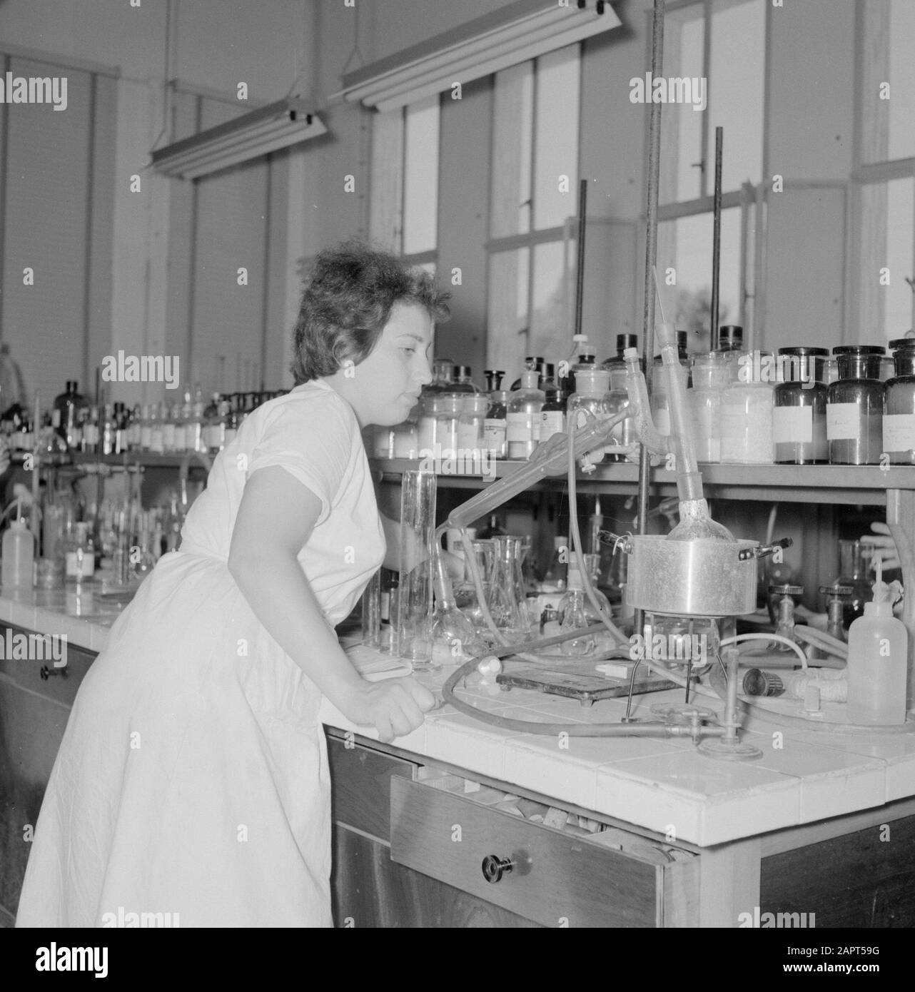 Plantex fertilizer plant near Haifa, laboratory. Laborante at work with ...