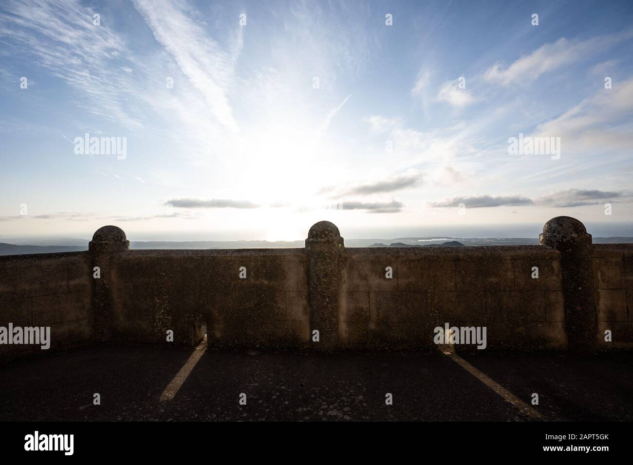 great stone wall in front of a amazing sunrise Stock Photo - Alamy
