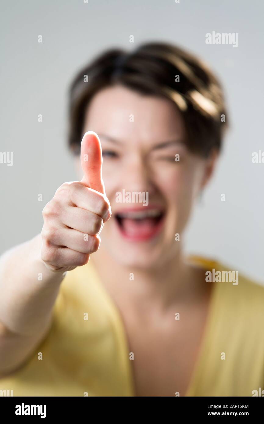 Gesturing thumbs ups hi-res stock photography and images - Alamy