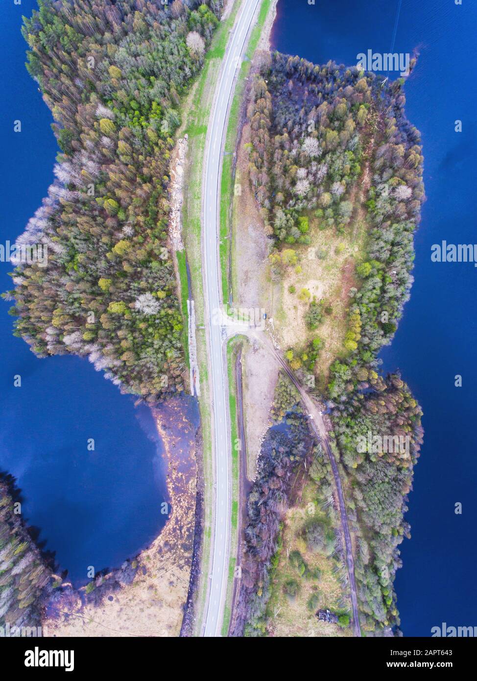 Beautiful view from a road going through the beautiful lake and forest ...