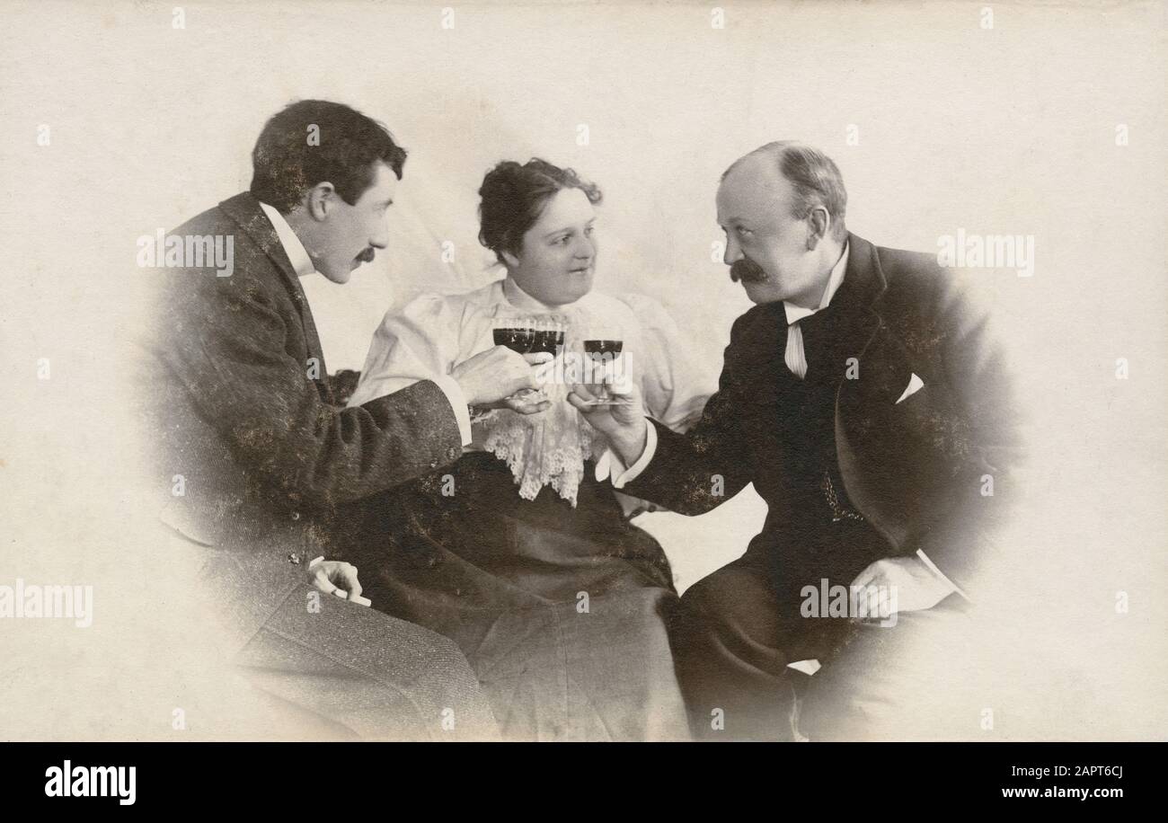 Antique 1898 photograph, three people toasting with wine. Location: New ...