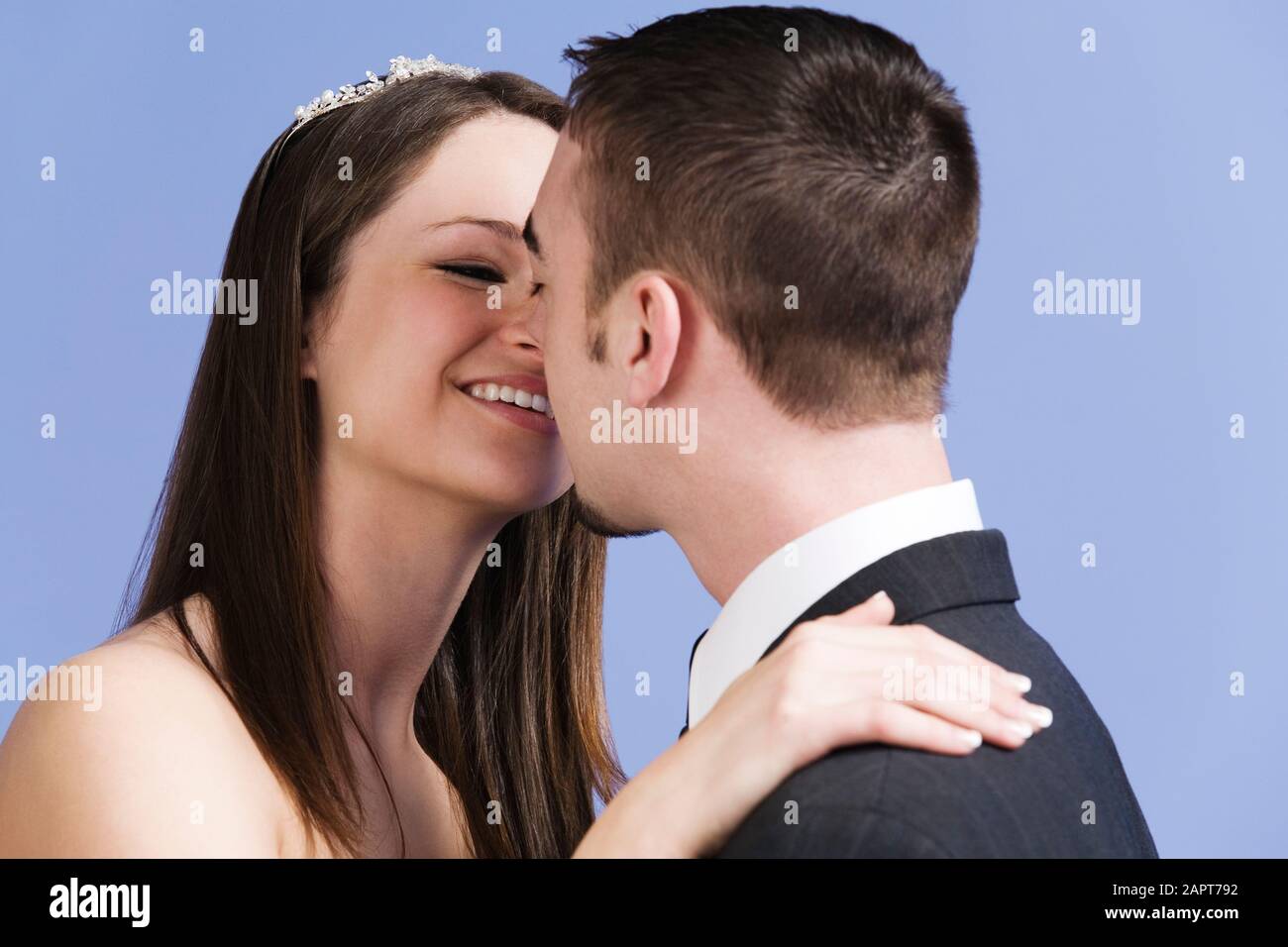 Side view of smiling bride and groom Stock Photo - Alamy