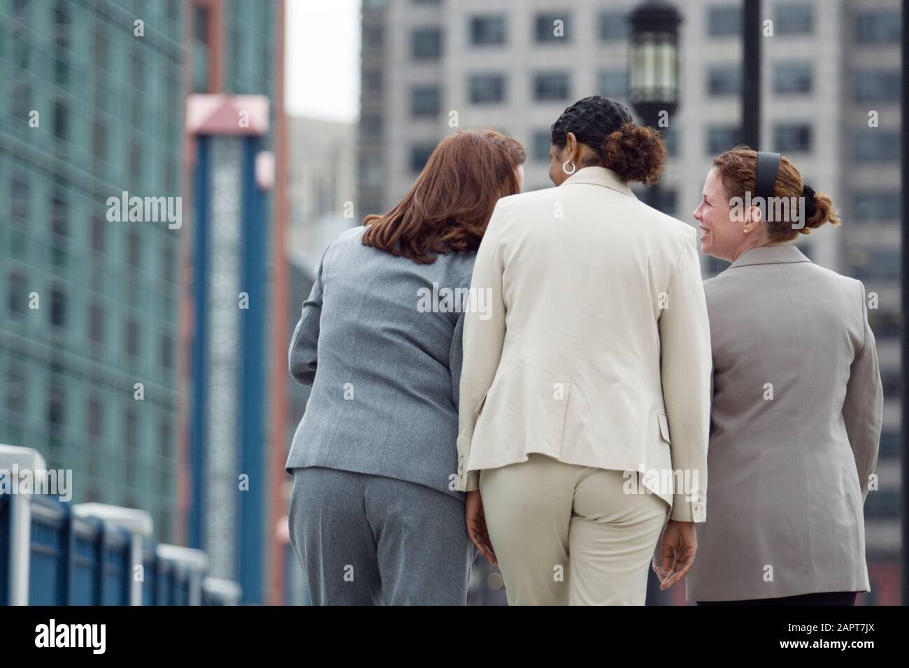 Three professionals stands hi-res stock photography and images - Alamy