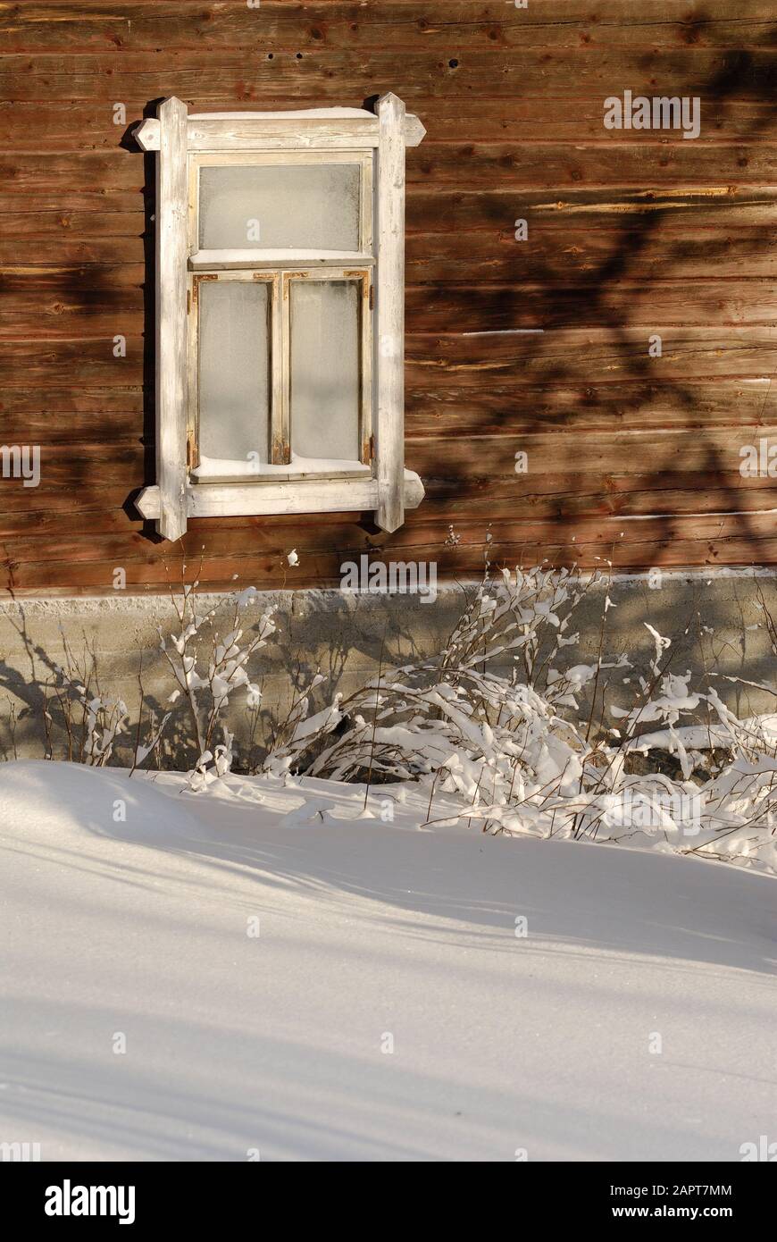 Icy cottage window in midwinter, snow outside Stock Photo - Alamy