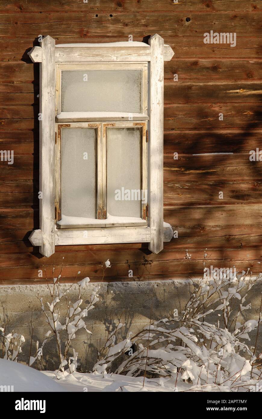 Icy cottage window in mid winter, snow outside Stock Photo - Alamy