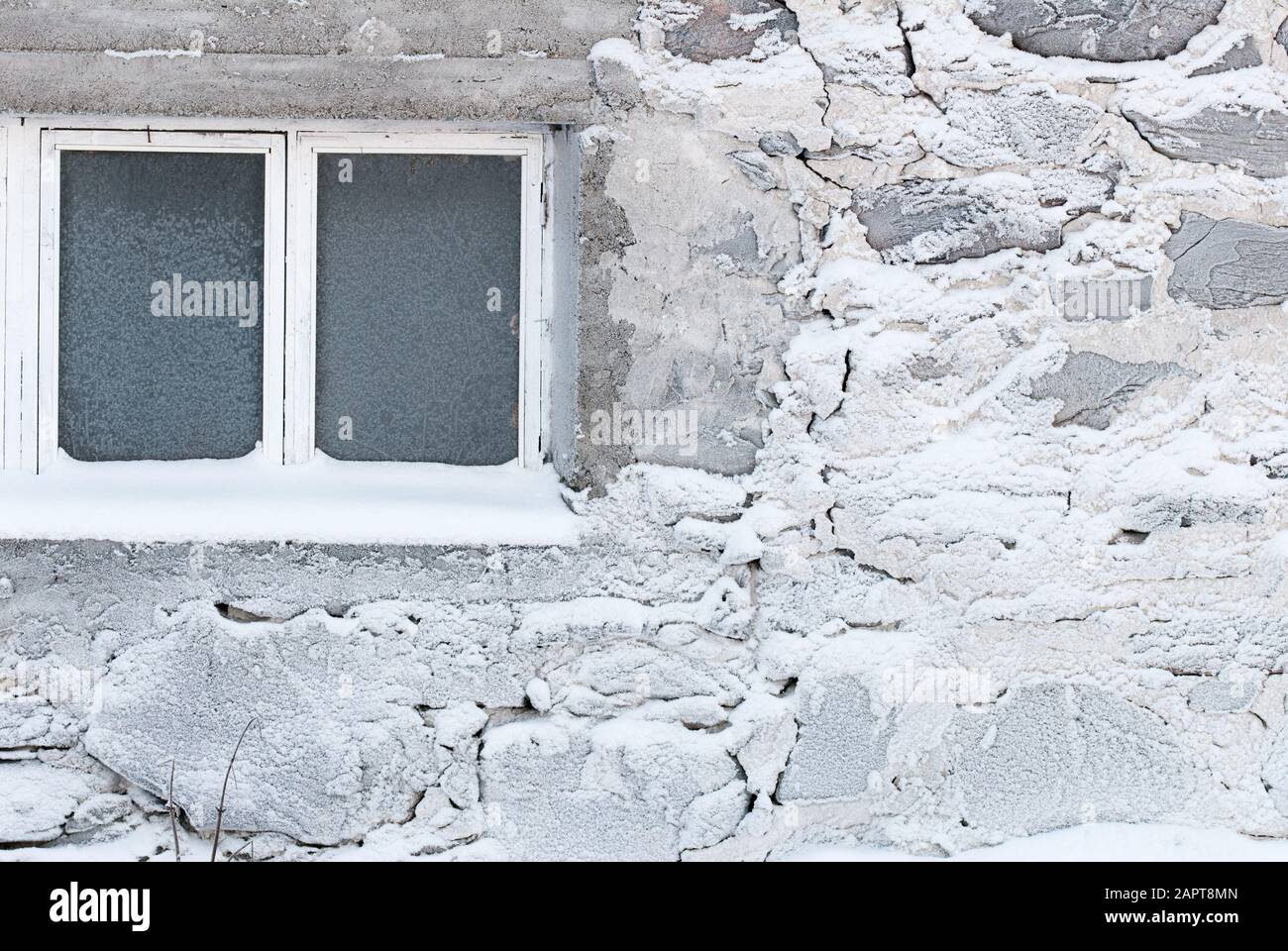 Frost and rime ice covered window and stone wall Stock Photo - Alamy