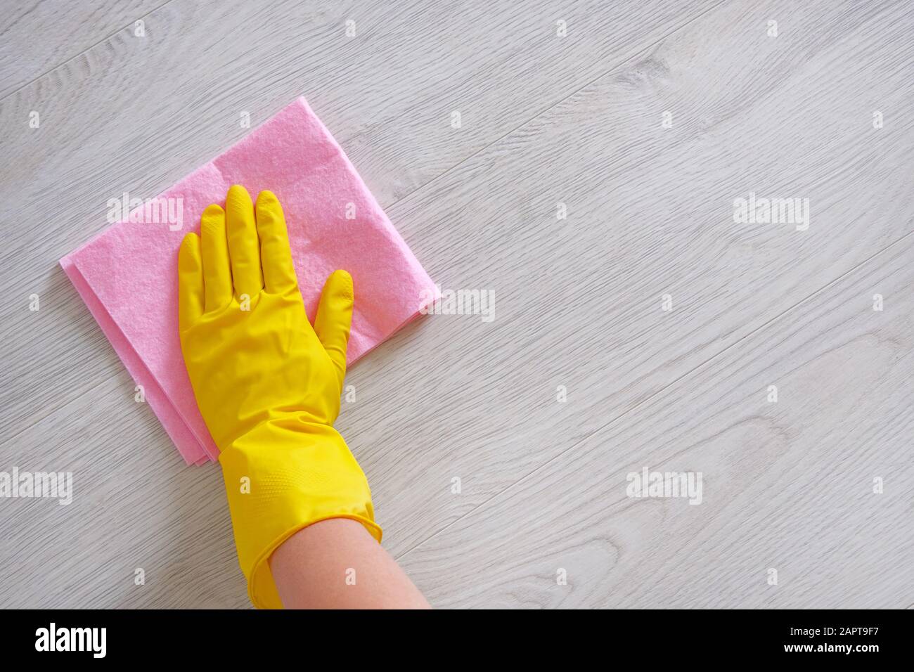 Cleaning concept in office, home. Female hand with pink rag is wipes ...