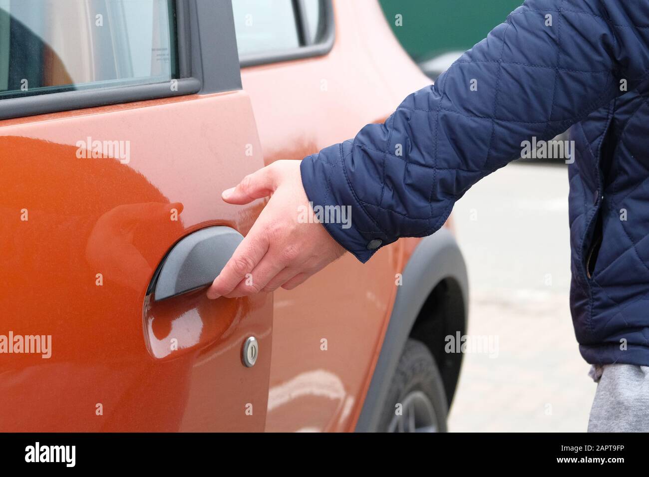 Hand holding man by jacket hi-res stock photography and images - Alamy