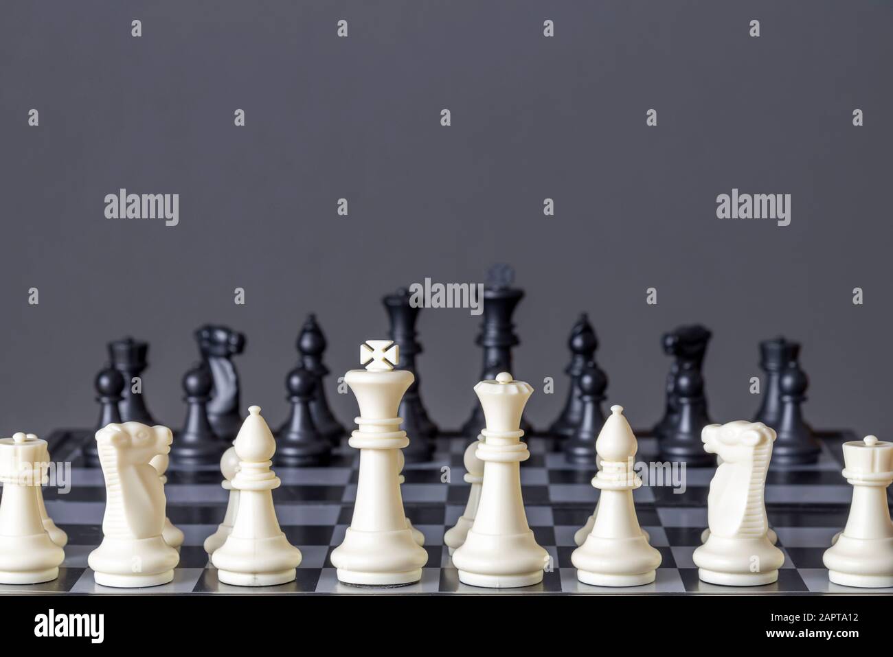 Game on chess play background Stock Photo - Alamy