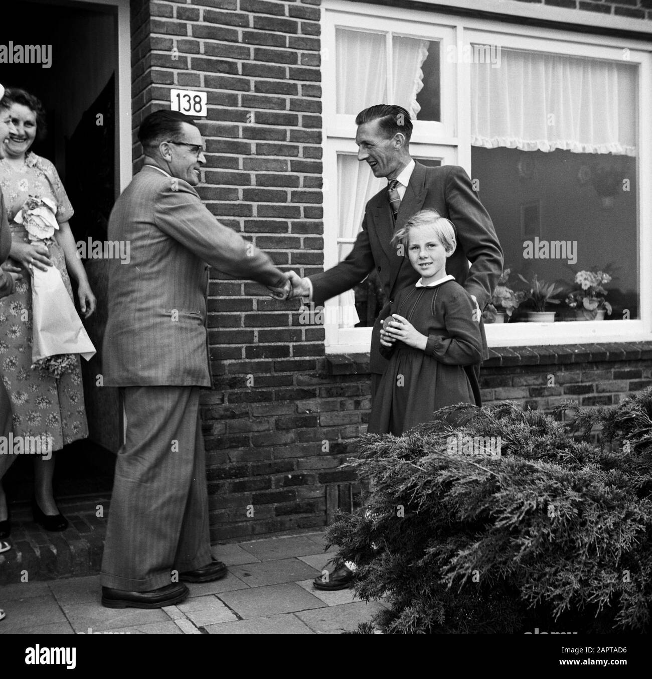 Gerard de Jong (right in the picture) at the front door of his house ...