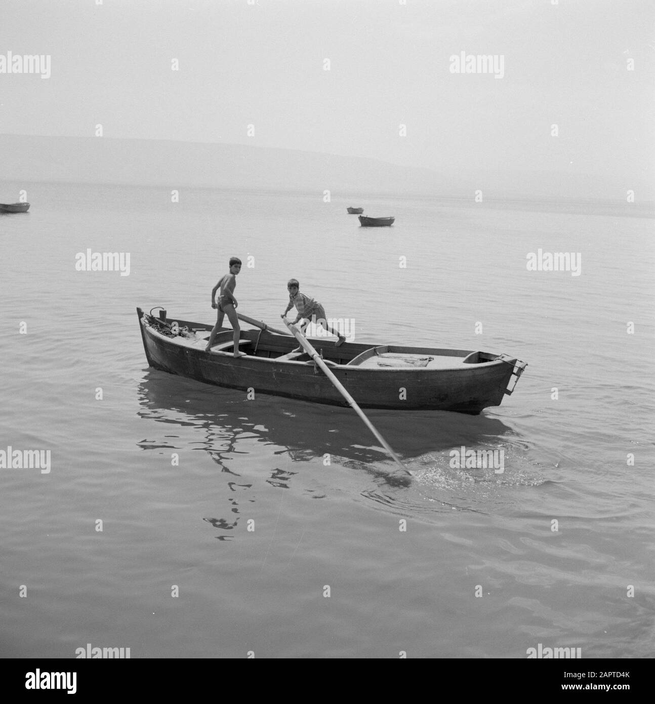 Two children on a rowing boat hi-res stock photography and images - Alamy