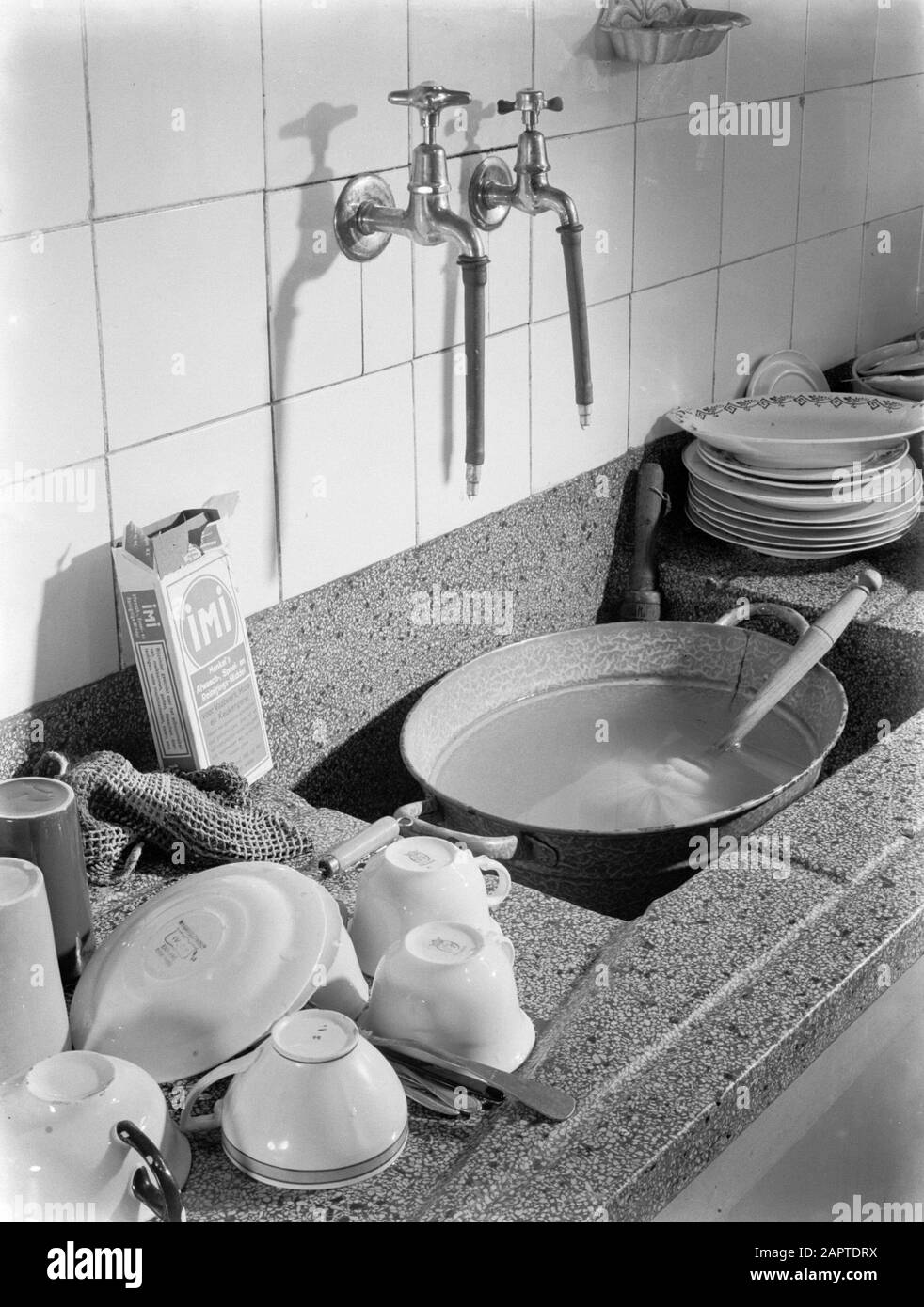 Family photos Sash and countertop with dishes Date: 1933 Keywords ...