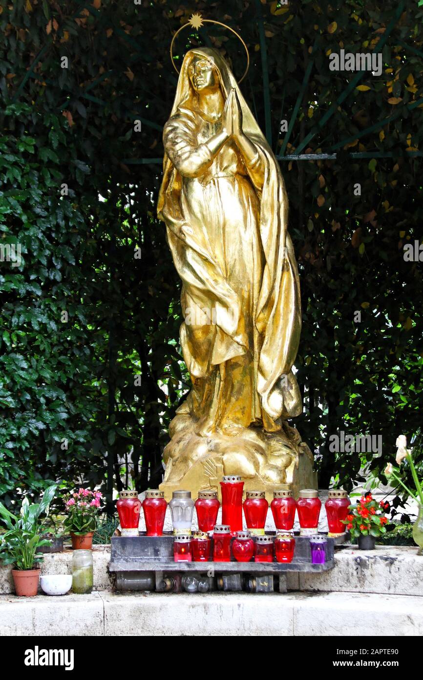 Religious statue of golden Madonna in Opatija Stock Photo - Alamy
