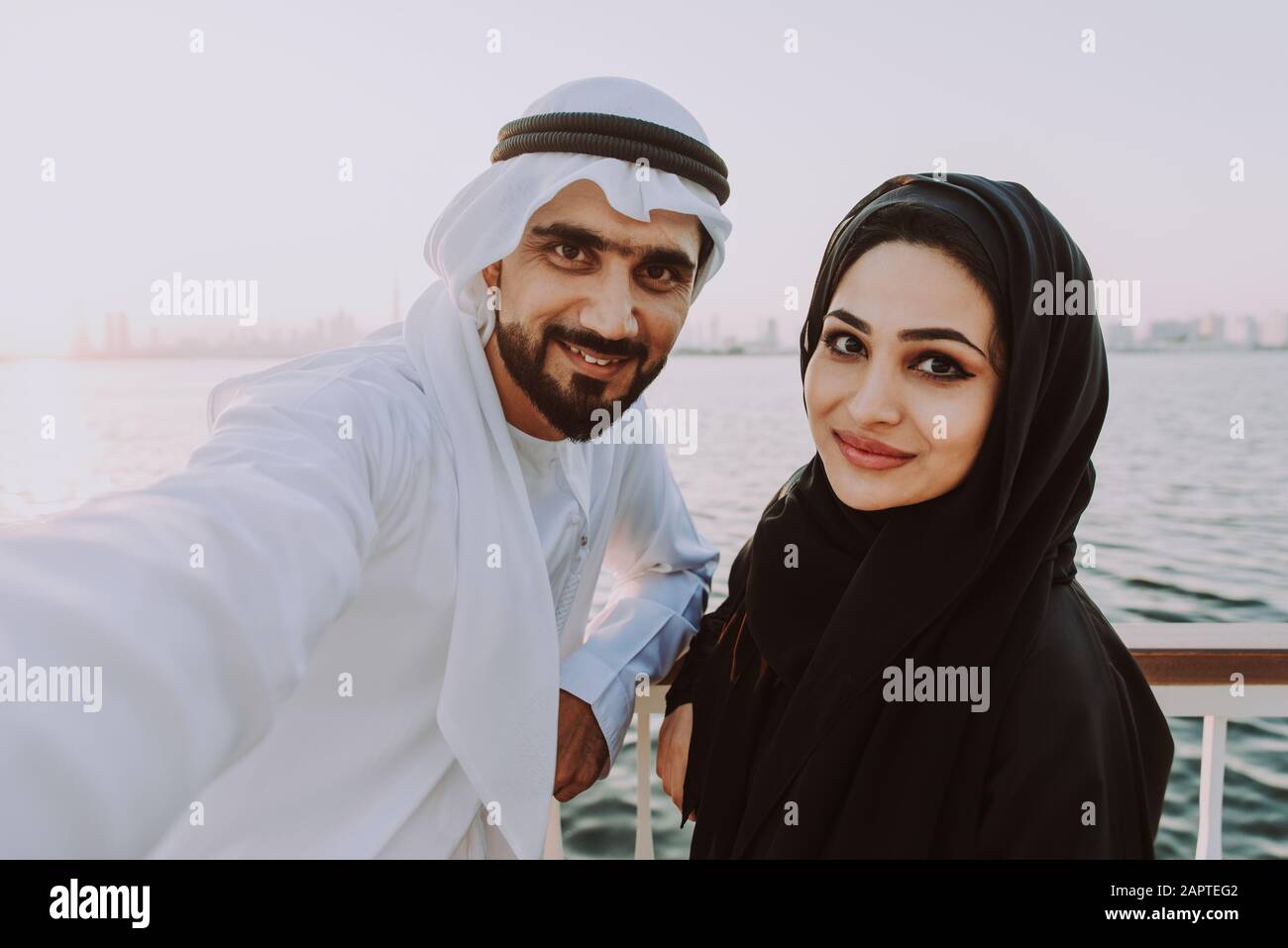 Beautiful middle eastern couple dating outdoors in Dubai - Married pair ...