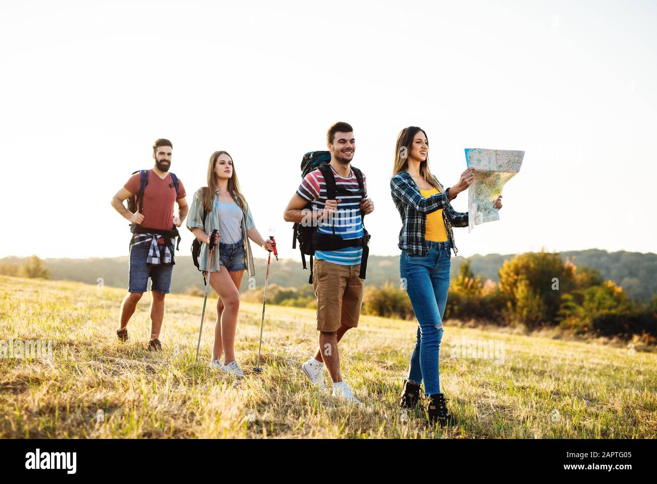 adventure, travel, tourism, hike and people concept - group of smiling ...