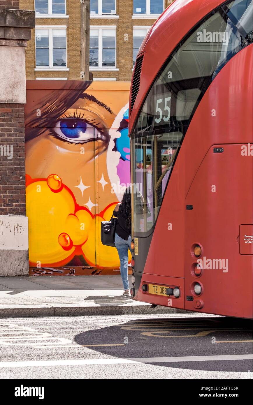London Bus Passing Street Art Stock Photo - Alamy
