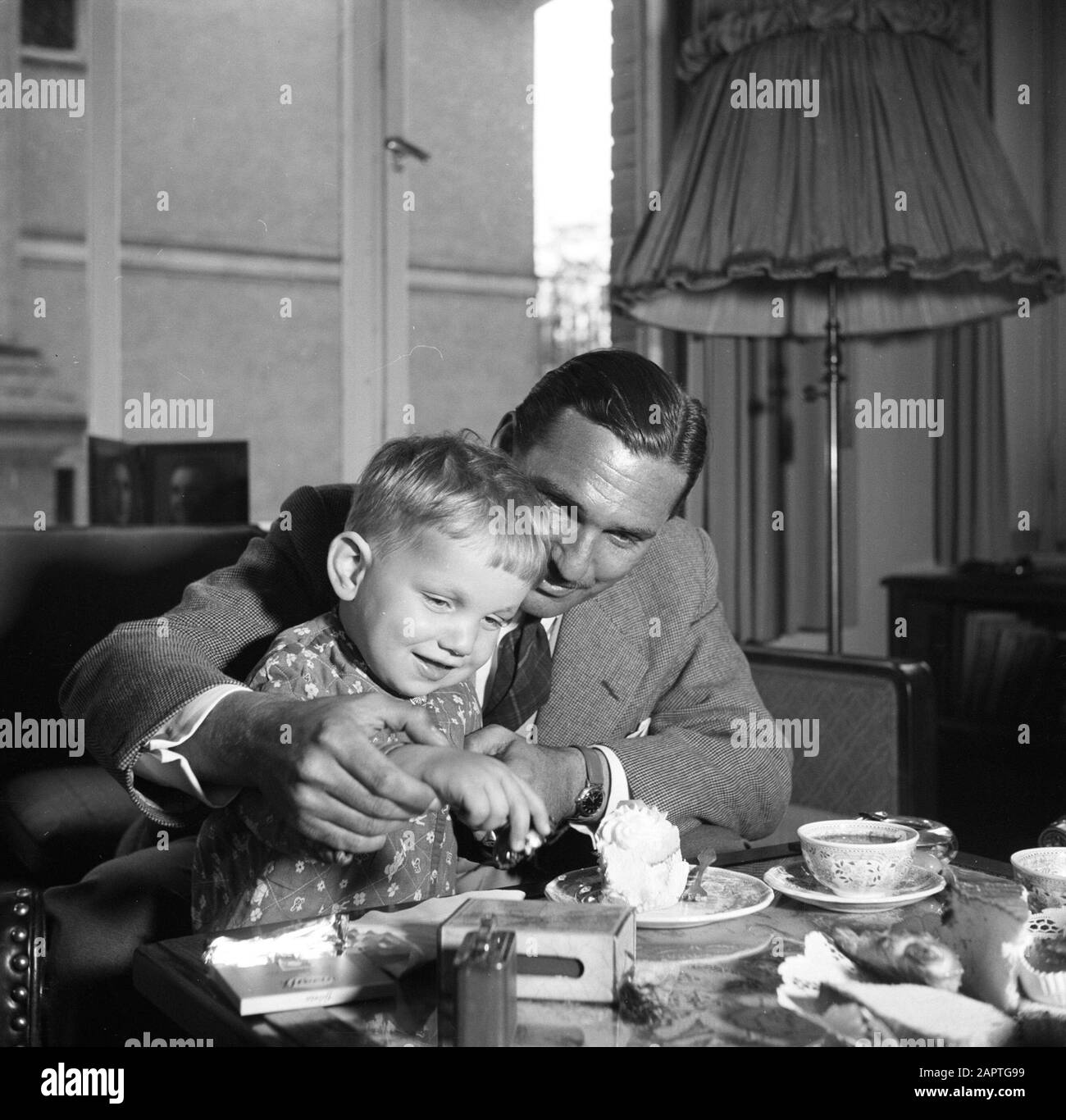 Child seating at table Black and White Stock Photos & Images - Alamy