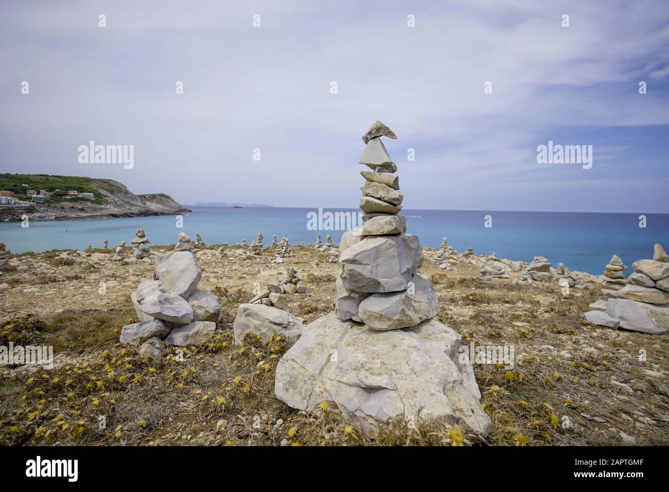Stacked stones on a coast with ocean background Stock Photo - Alamy