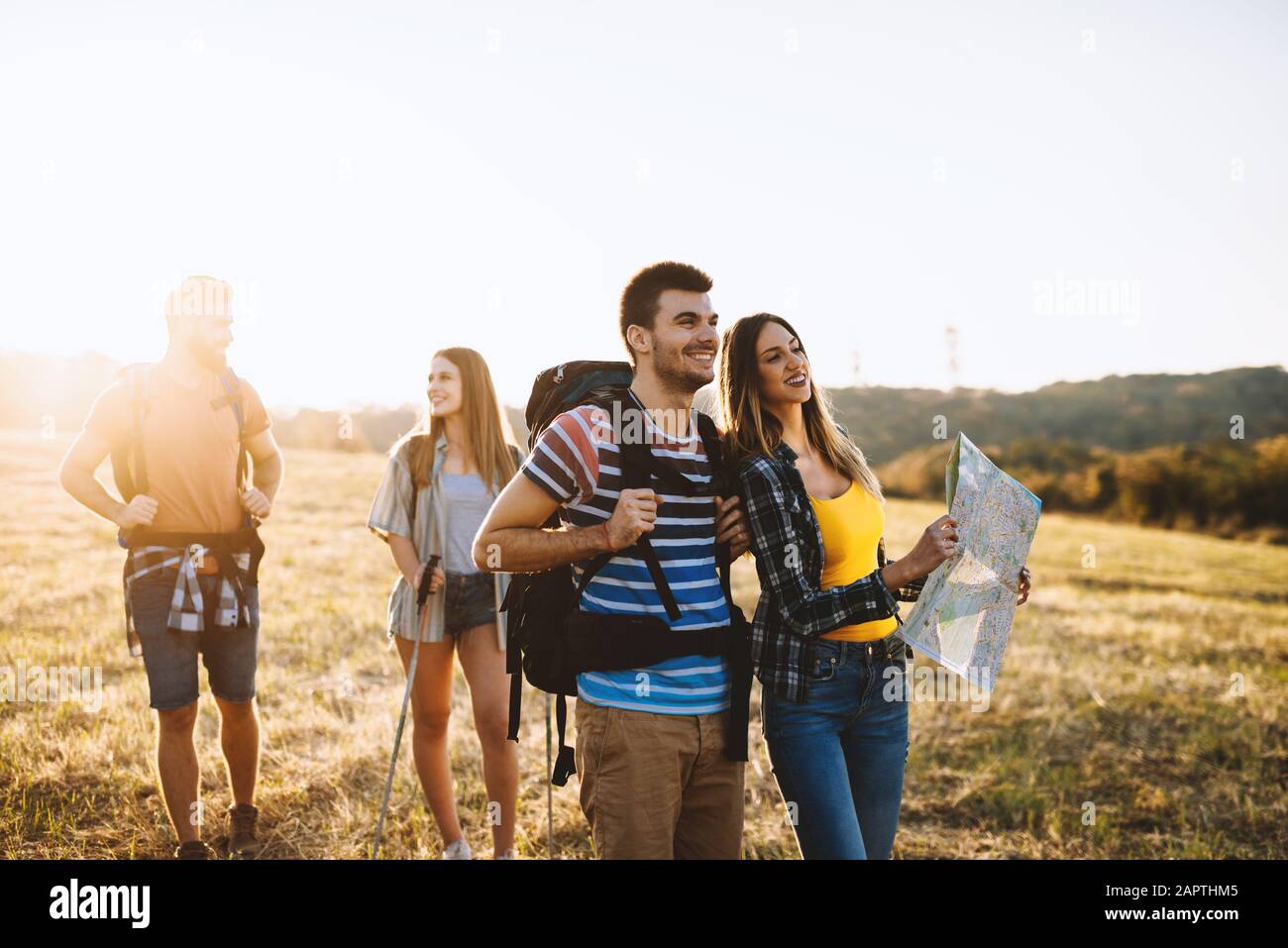 adventure, travel, tourism, hike and people concept - group of smiling ...