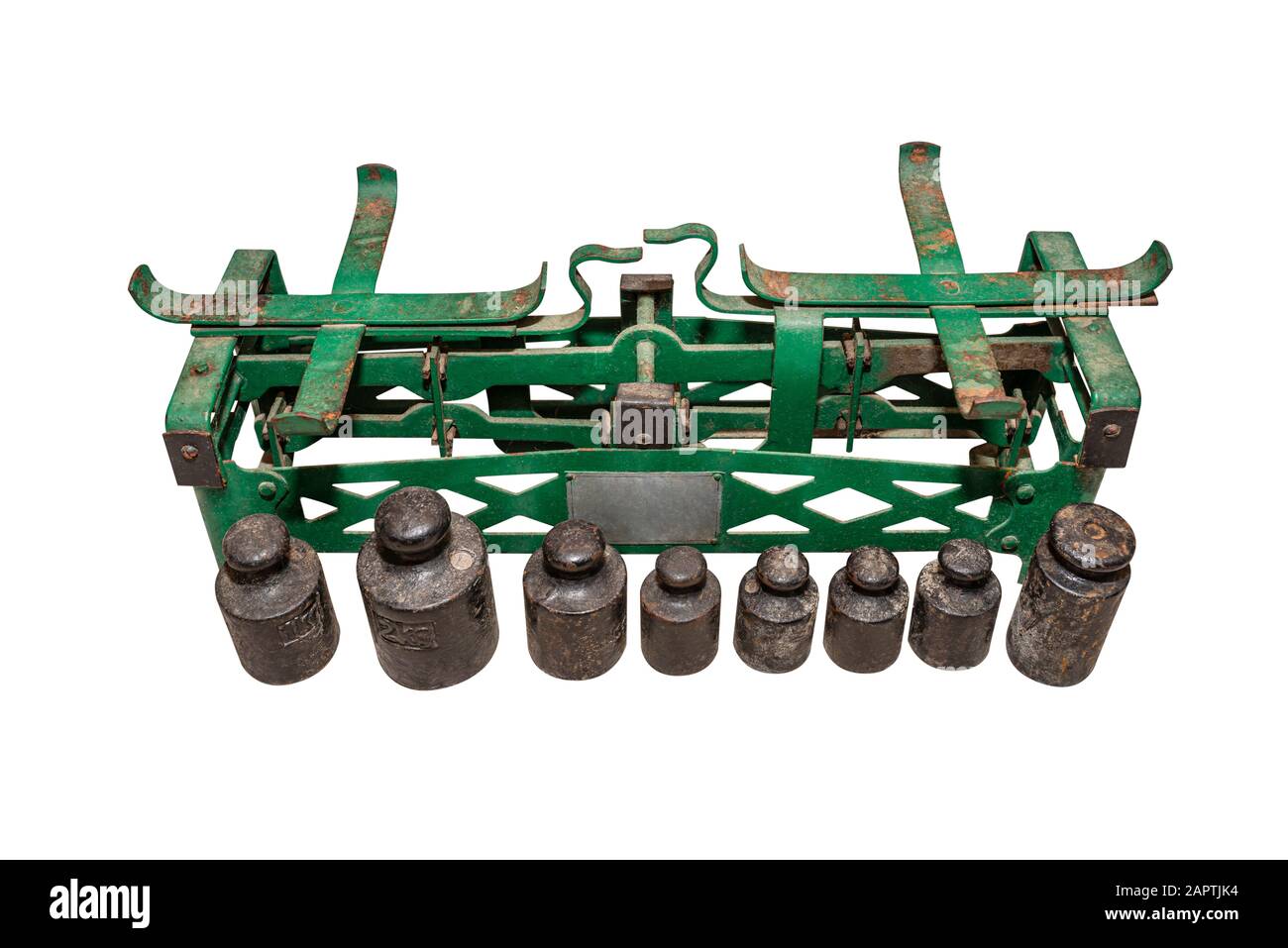 An old, green weight scale with a row of weights, isolated on a white ...