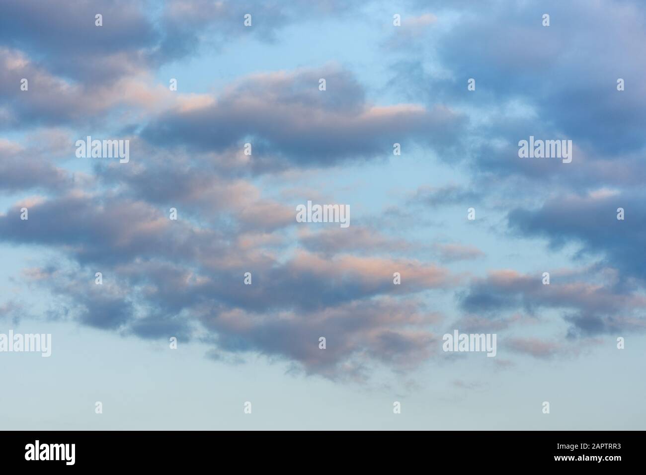 texture bright contrast sky with clouds and sun rays Stock Photo - Alamy