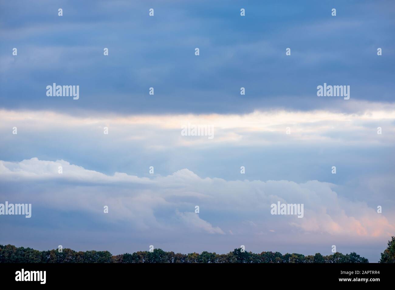 texture of the sky clouds and rays of sun on a background of blue sky ...