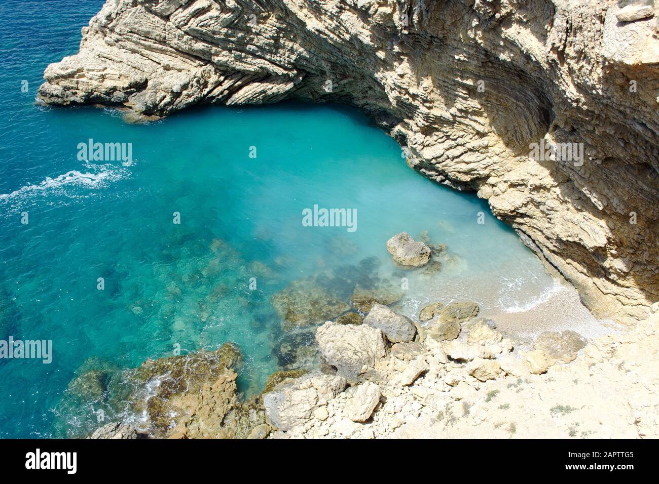 Beautiful rocky coast at the sea with blue clean water without people ...
