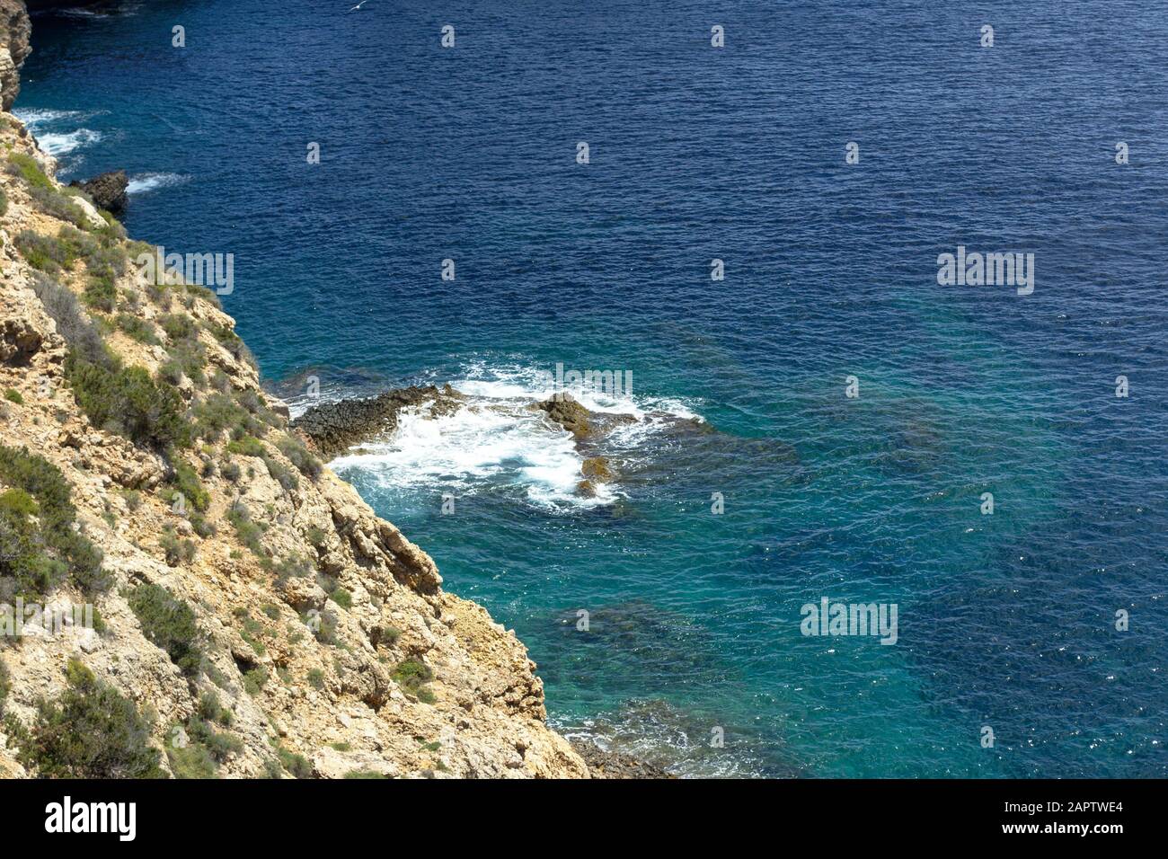 Beautiful rocky coast at the Balearic sea with blue clean water without ...