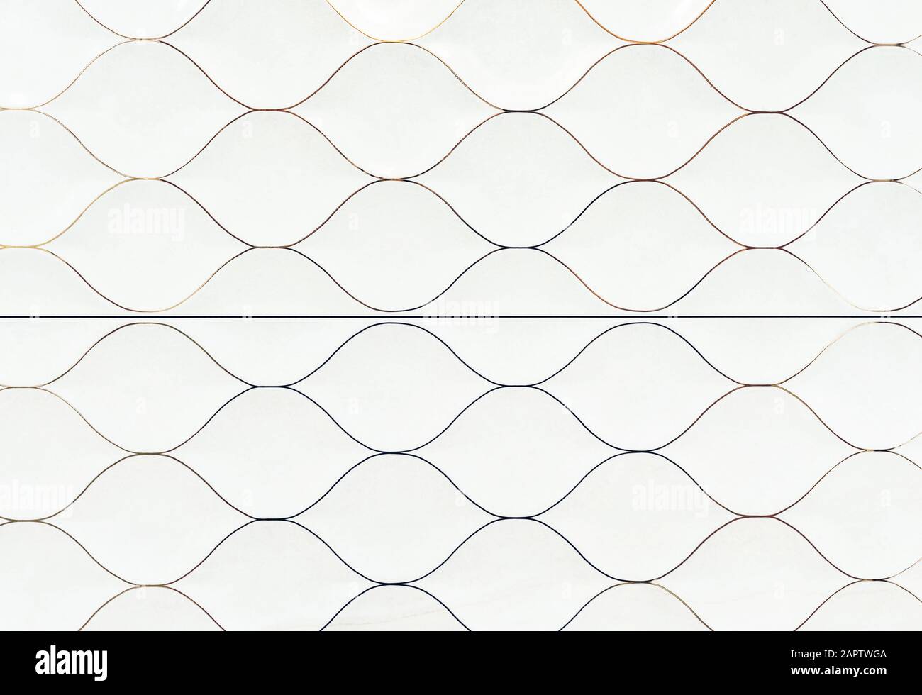 White ceramic tiles in the form of scales. Tile texture with a marine ...