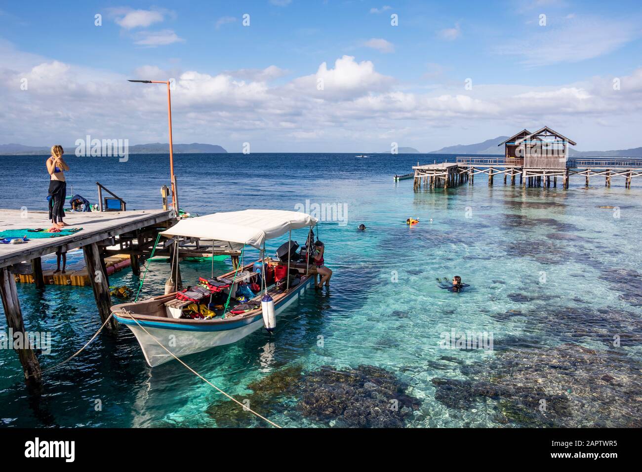 Pier over the coral reef; Arborek, West Papua, Indonesia Stock Photo ...