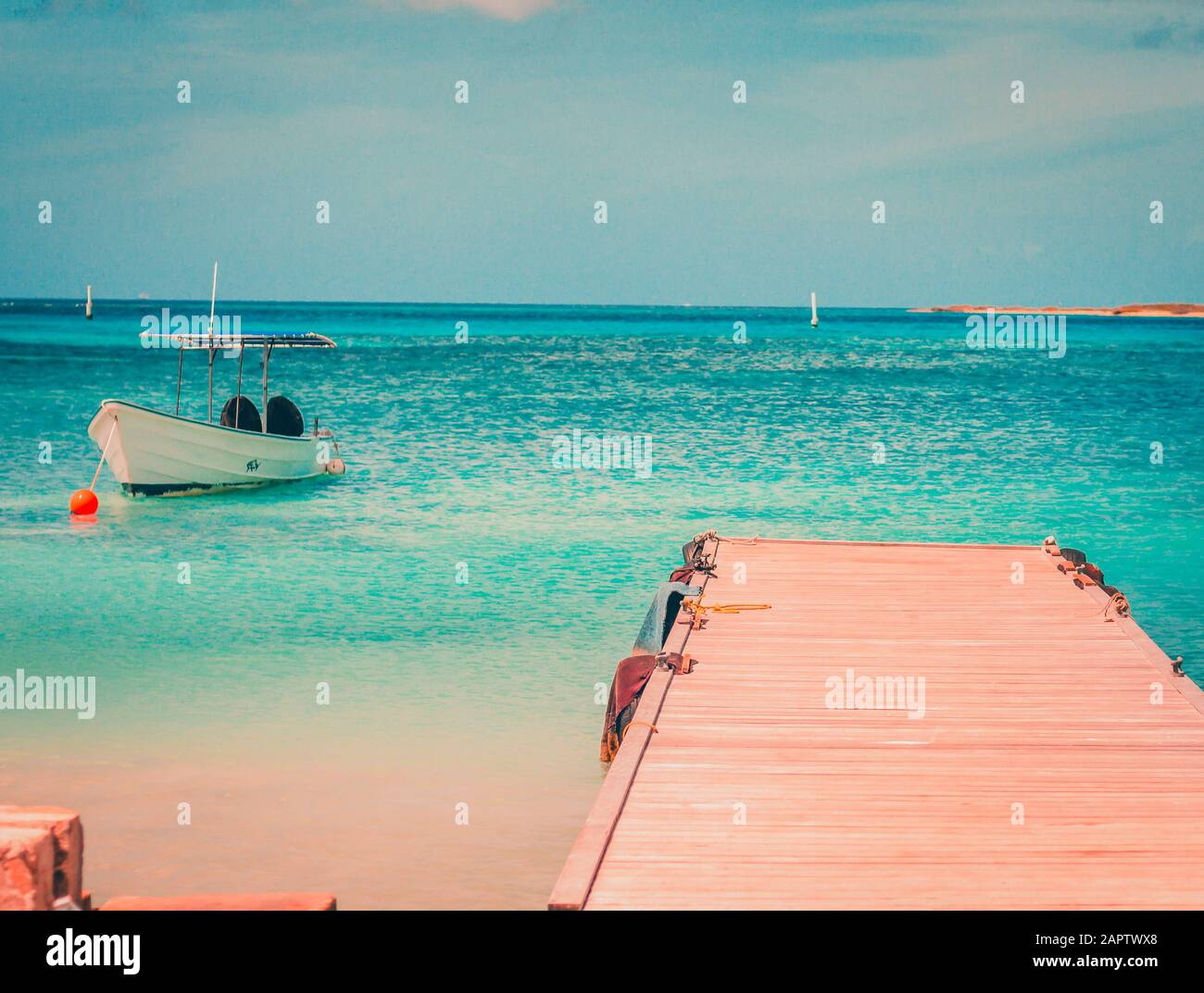Roger's Beach Aruba. Beautiful blue crystal clear beach. Fishing boat ...