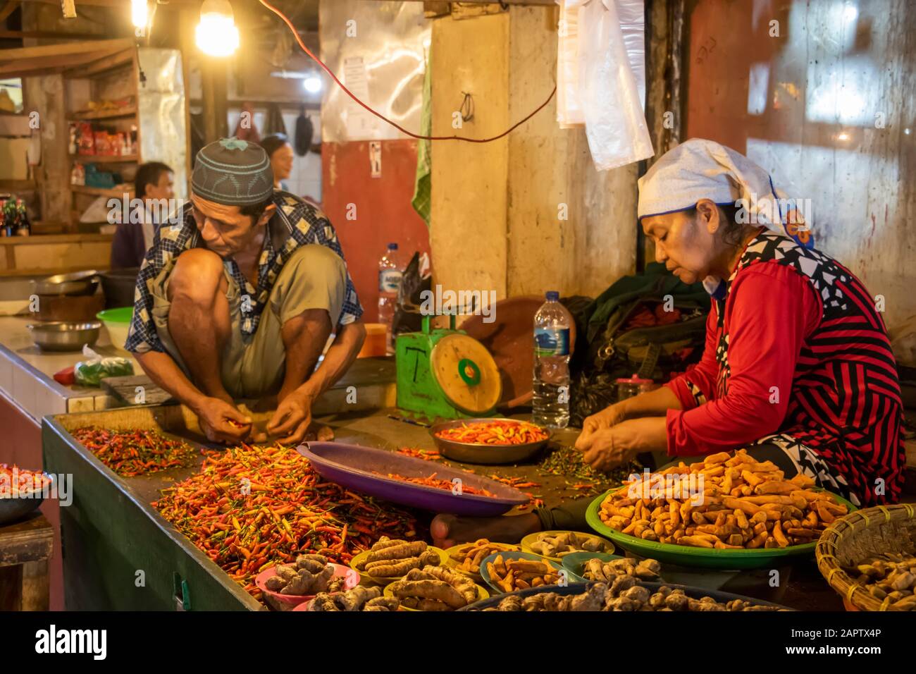 Chili pepper vendors at the market; Manado, North Sulawesi, Indonesia ...