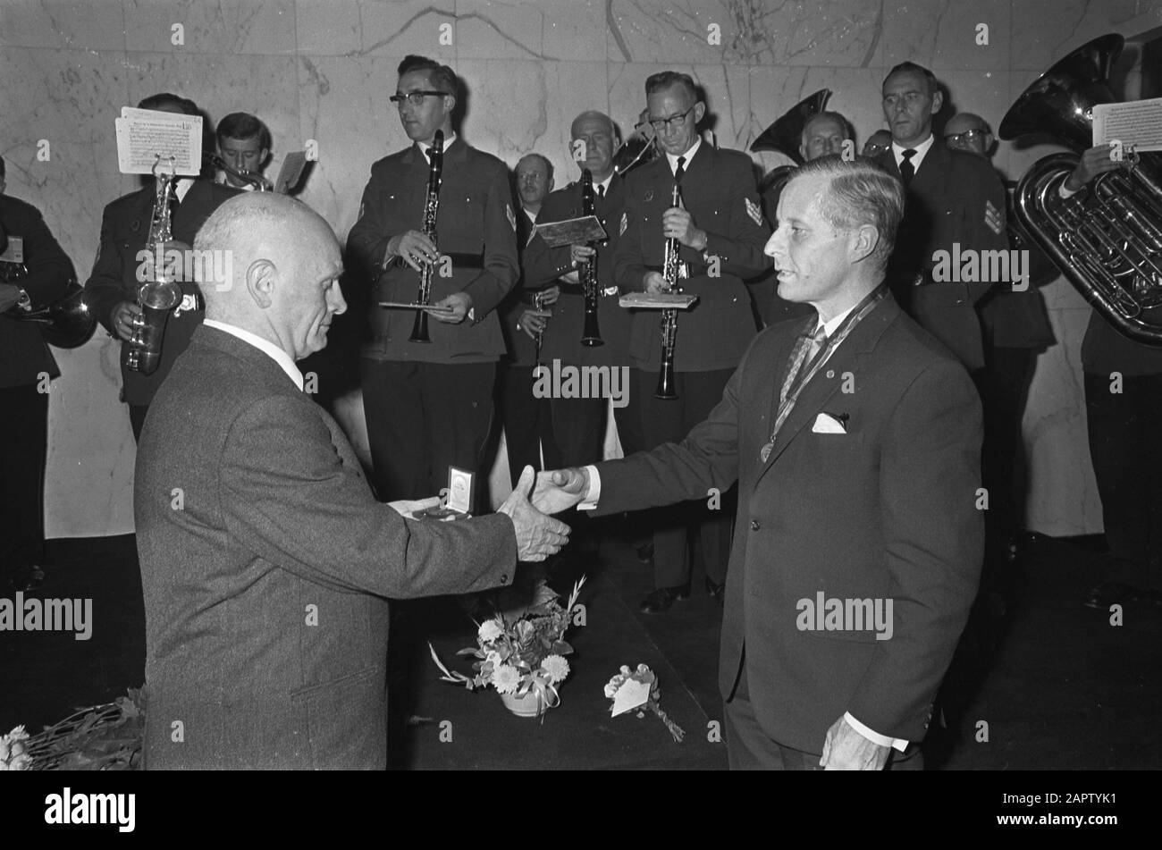 Jan Stender received Bredius medal. Right Mr. F. H. Drost who gives Jan ...