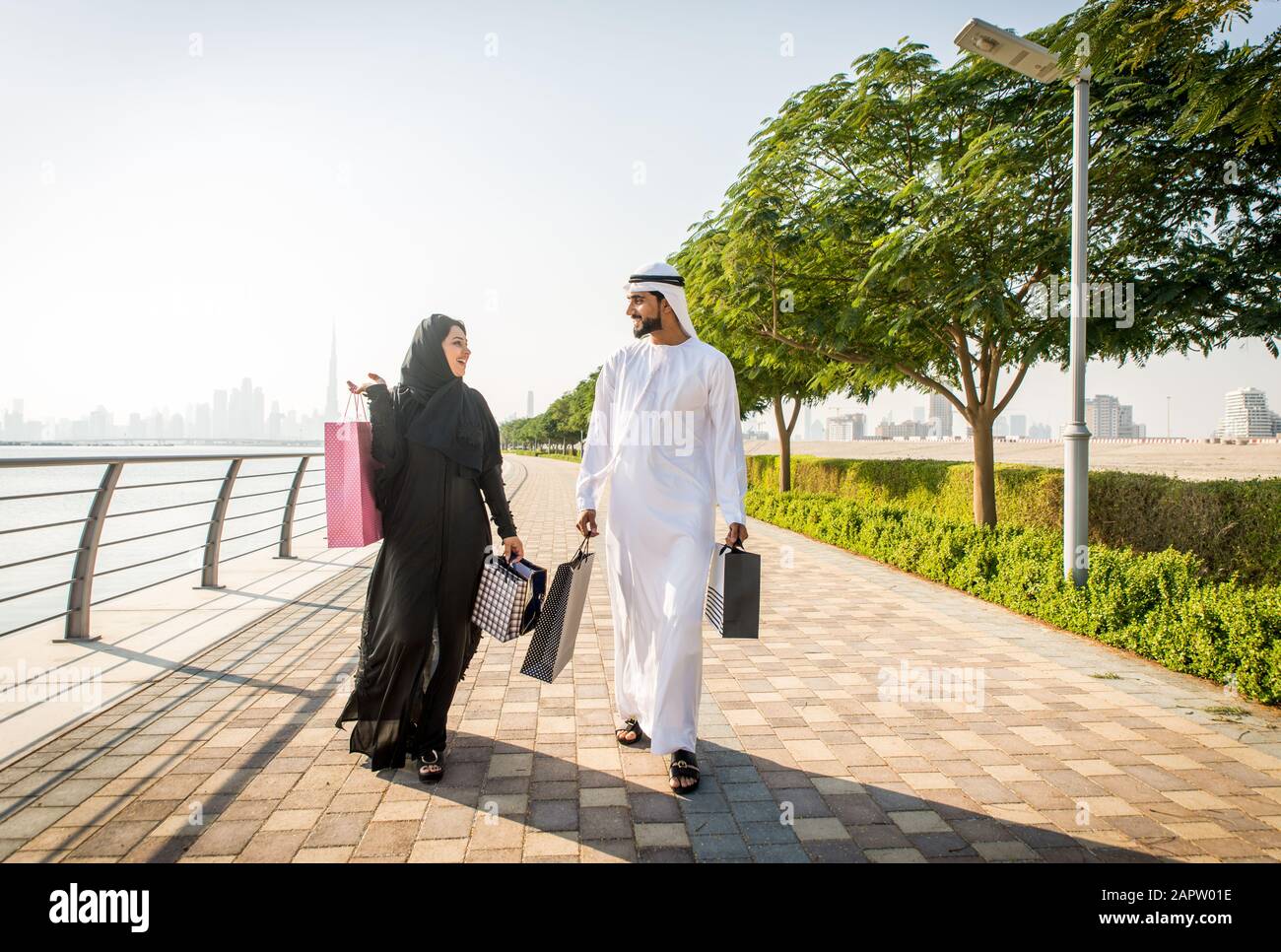 Beautiful middle eastern couple dating outdoors in Dubai - Married pair ...