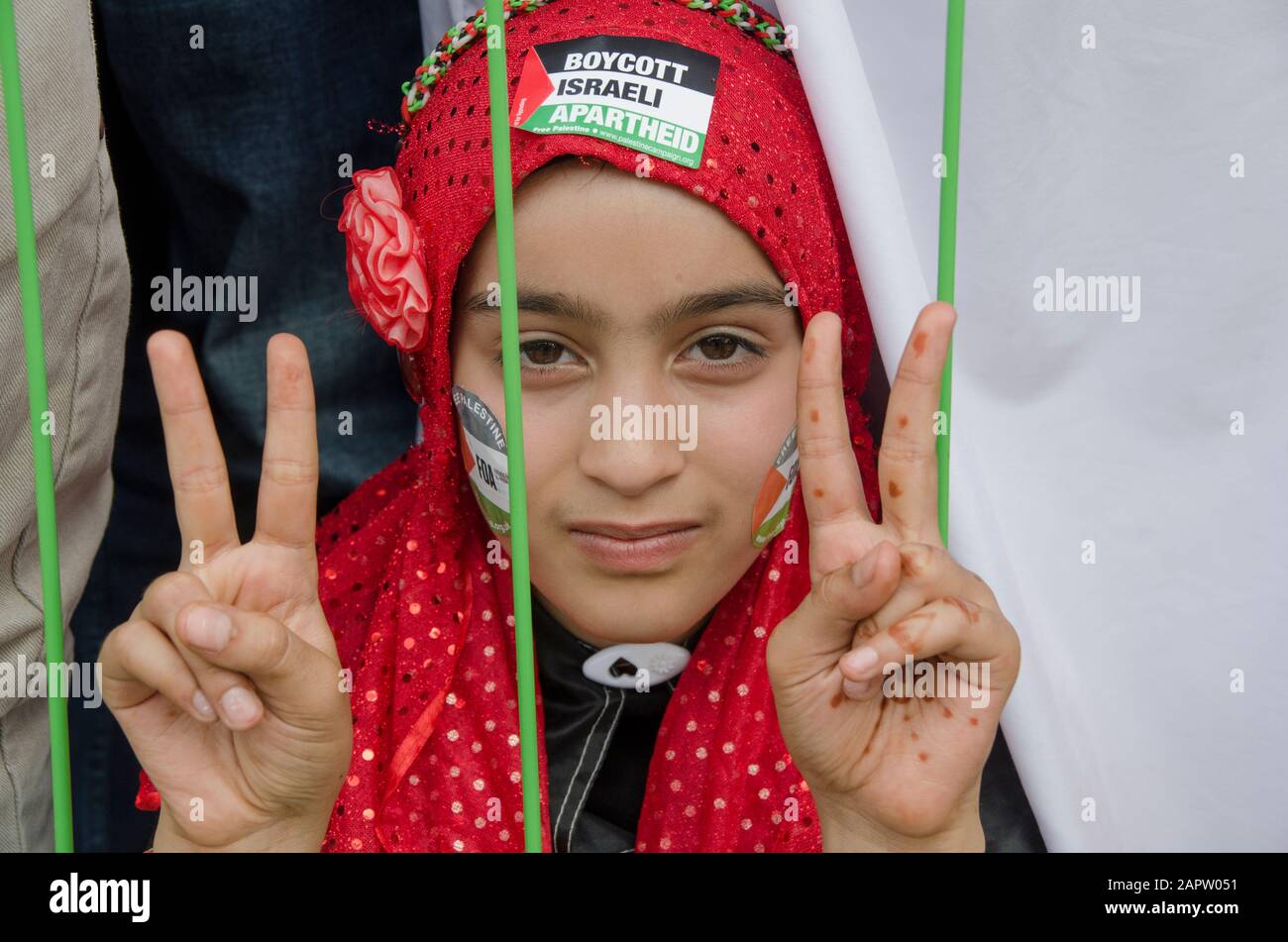 Palestinian Supporters Marching With Flags Banners And Placards