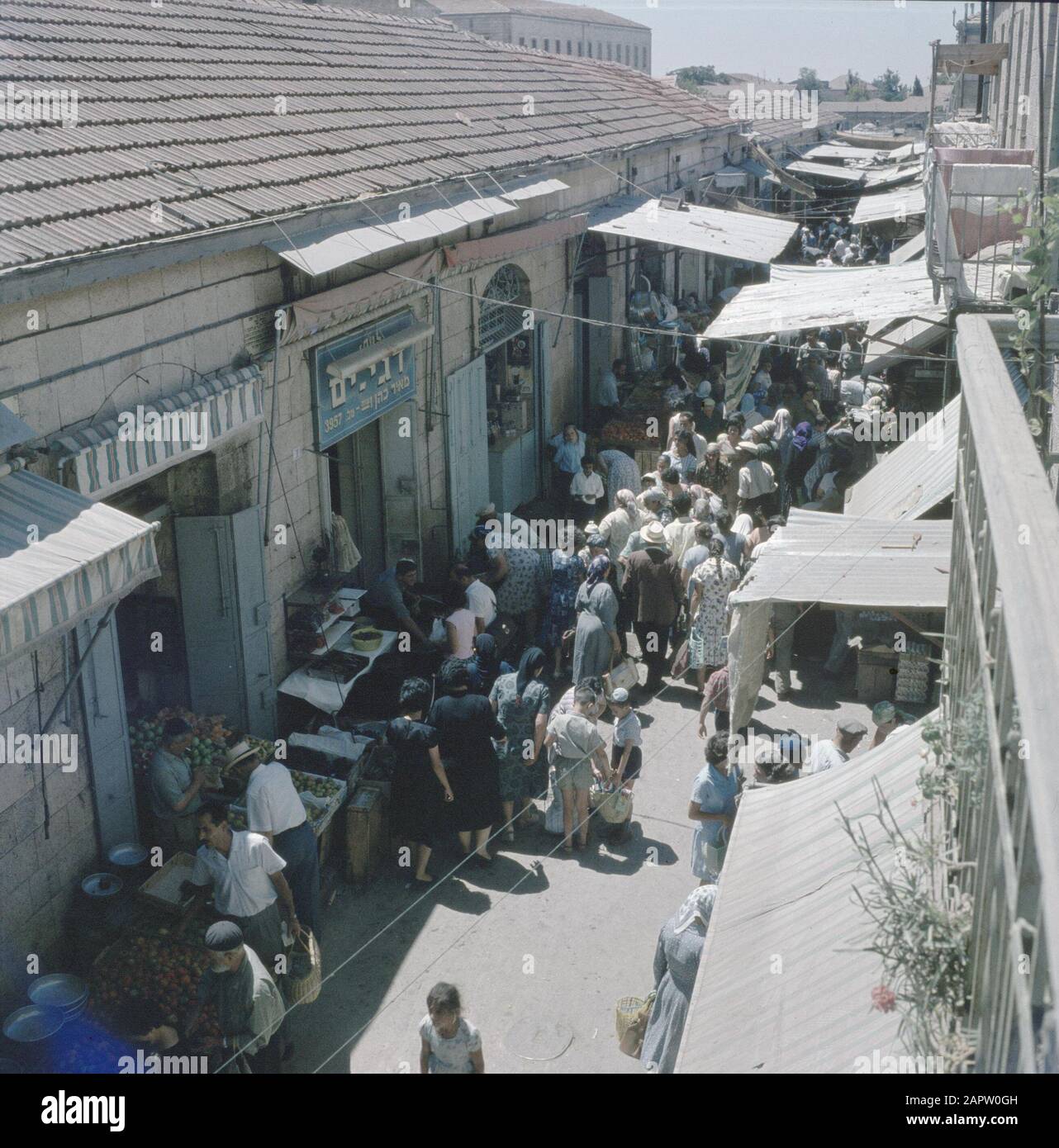 Israel 1964-1965 Jerusalem. Market table: narrow street with shops on ...