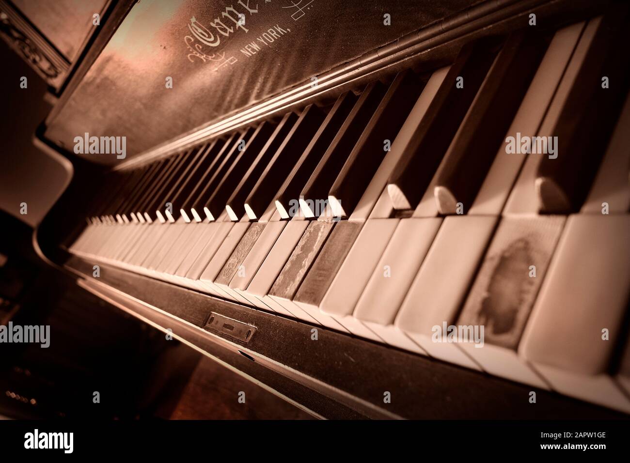 The keyboard of an upright piano Stock Photo - Alamy