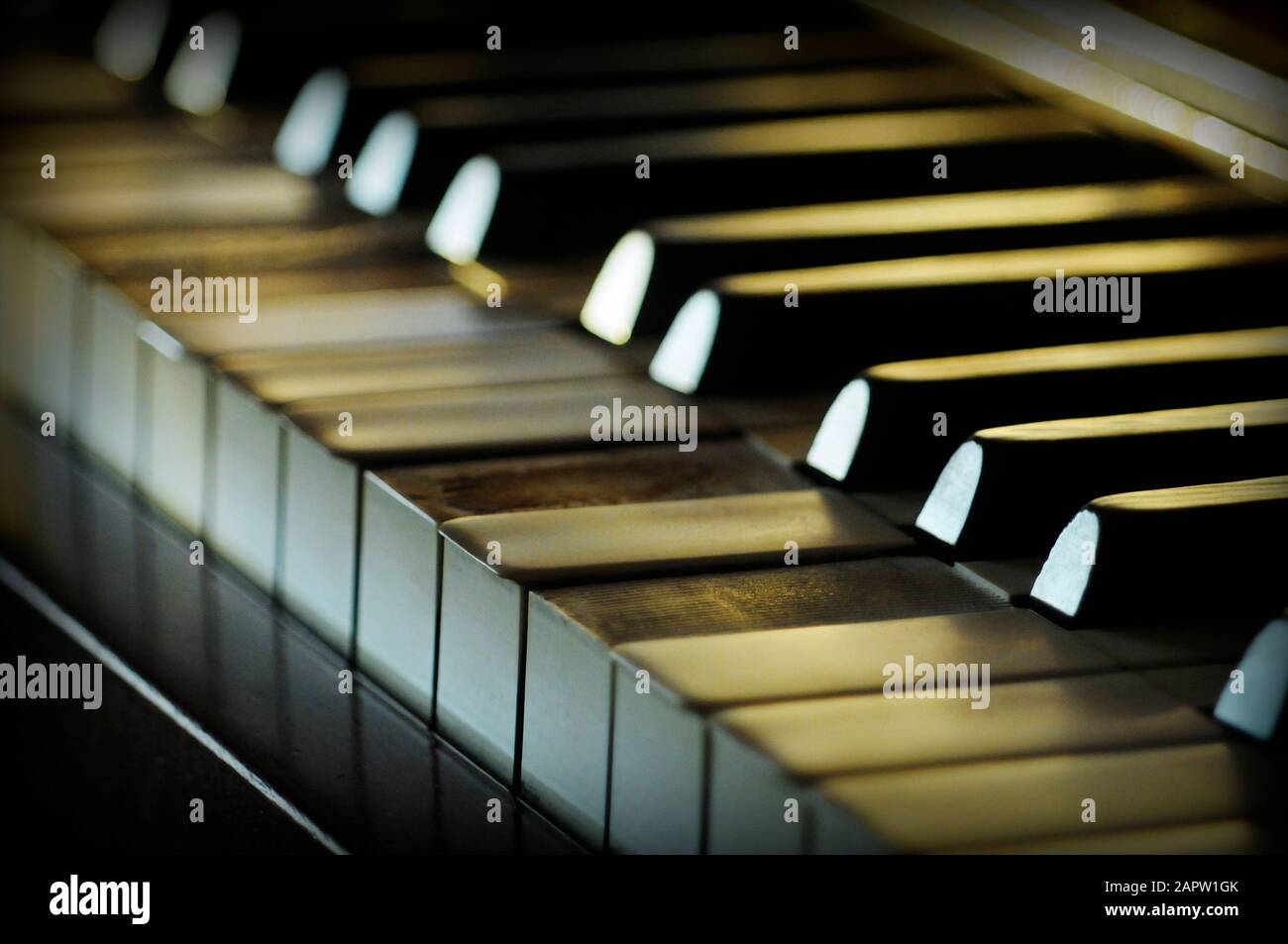 The keyboard of an upright piano Stock Photo - Alamy
