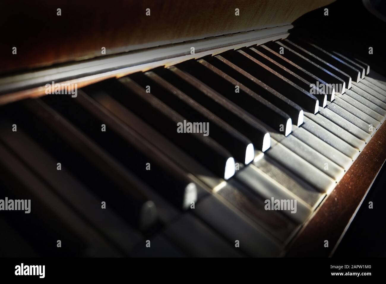The keyboard of an upright piano Stock Photo - Alamy