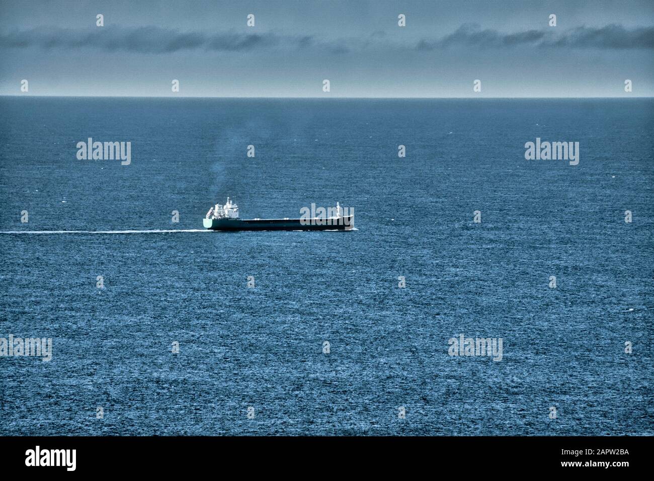 Ship in the open ocean Stock Photo - Alamy