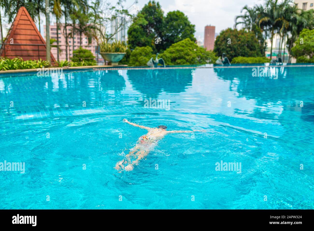The guy is swim in the pool on a hot summer day Stock Photo - Alamy