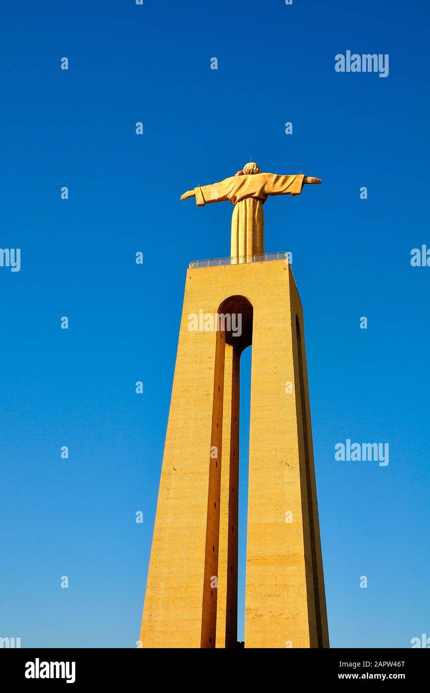 A rear view of the statue of Christ at Cristo Rei at Cacilhas ...