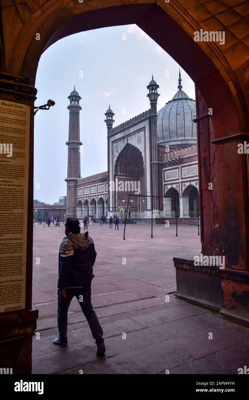 A visitor walks in a courtyard of the Jama Masjid or Grand Mosque in ...