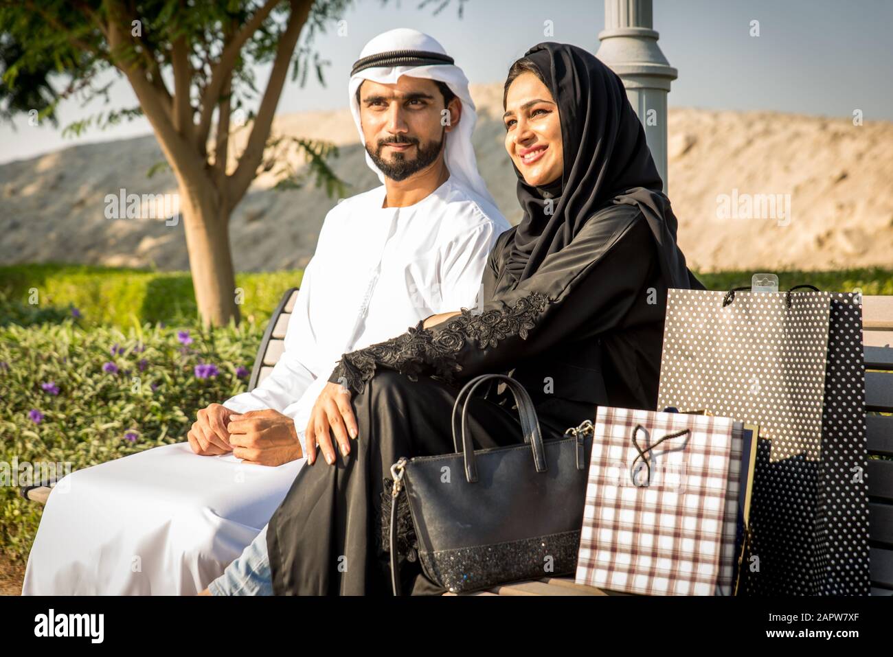 Beautiful middle eastern couple dating outdoors in Dubai - Married pair ...