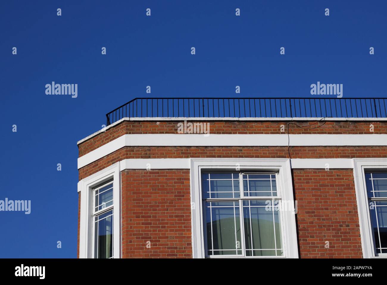 Deep blue sky with corner of building in foreground Stock Photo - Alamy