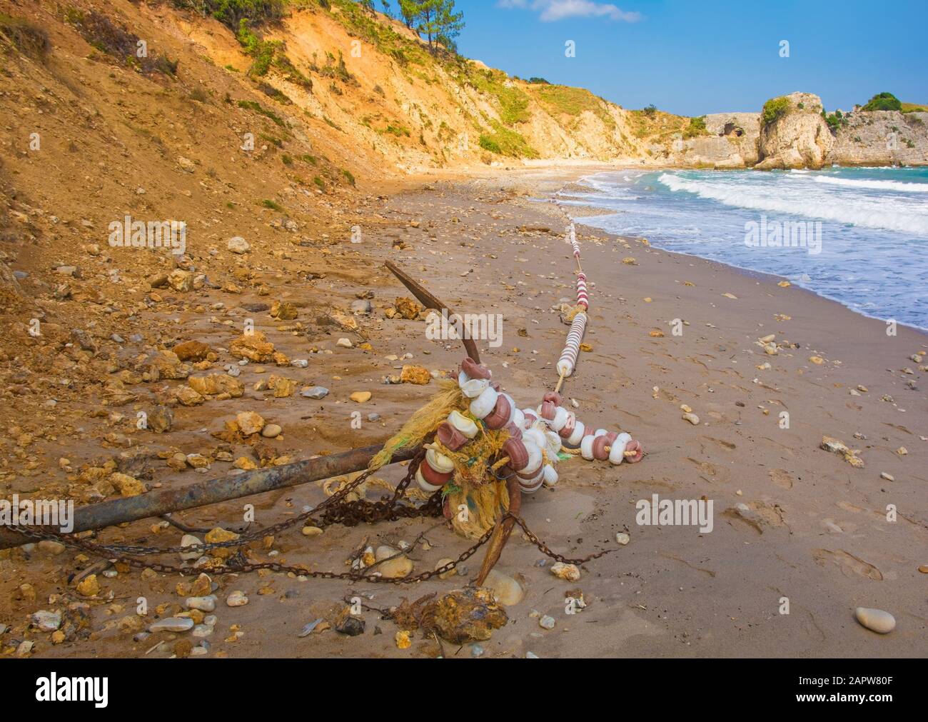 An old ship's anchor on the beach on the Black Sea coast at Kilimli Bay ...