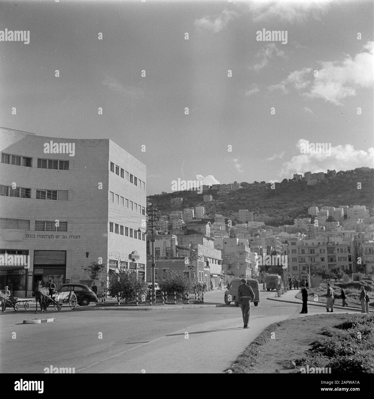 Israel 1948-1949: Haifa Crossroads with shops; in the background the ...